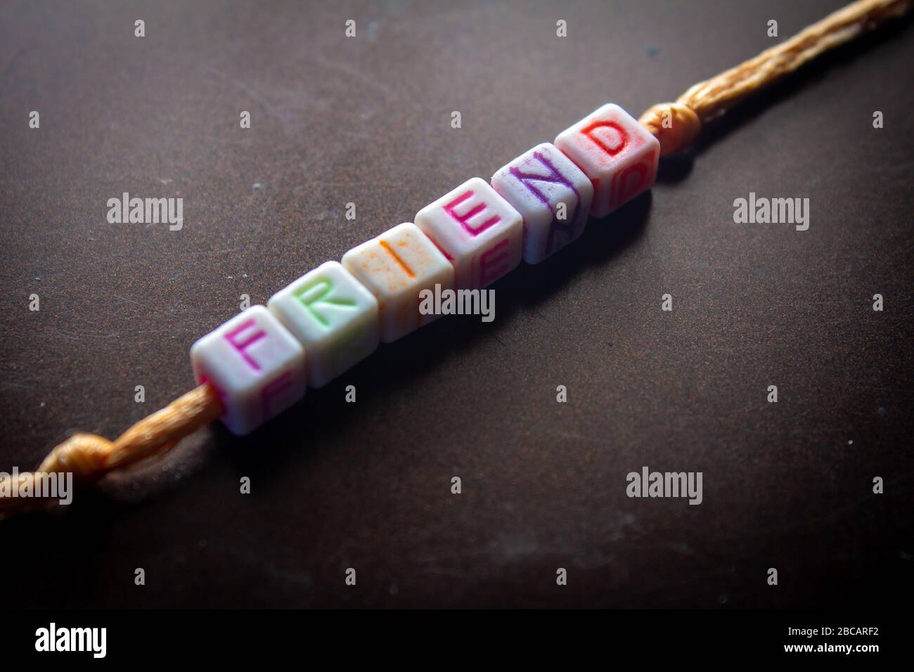 Friendship band with word friend featuring each alphabet with in a cube ...