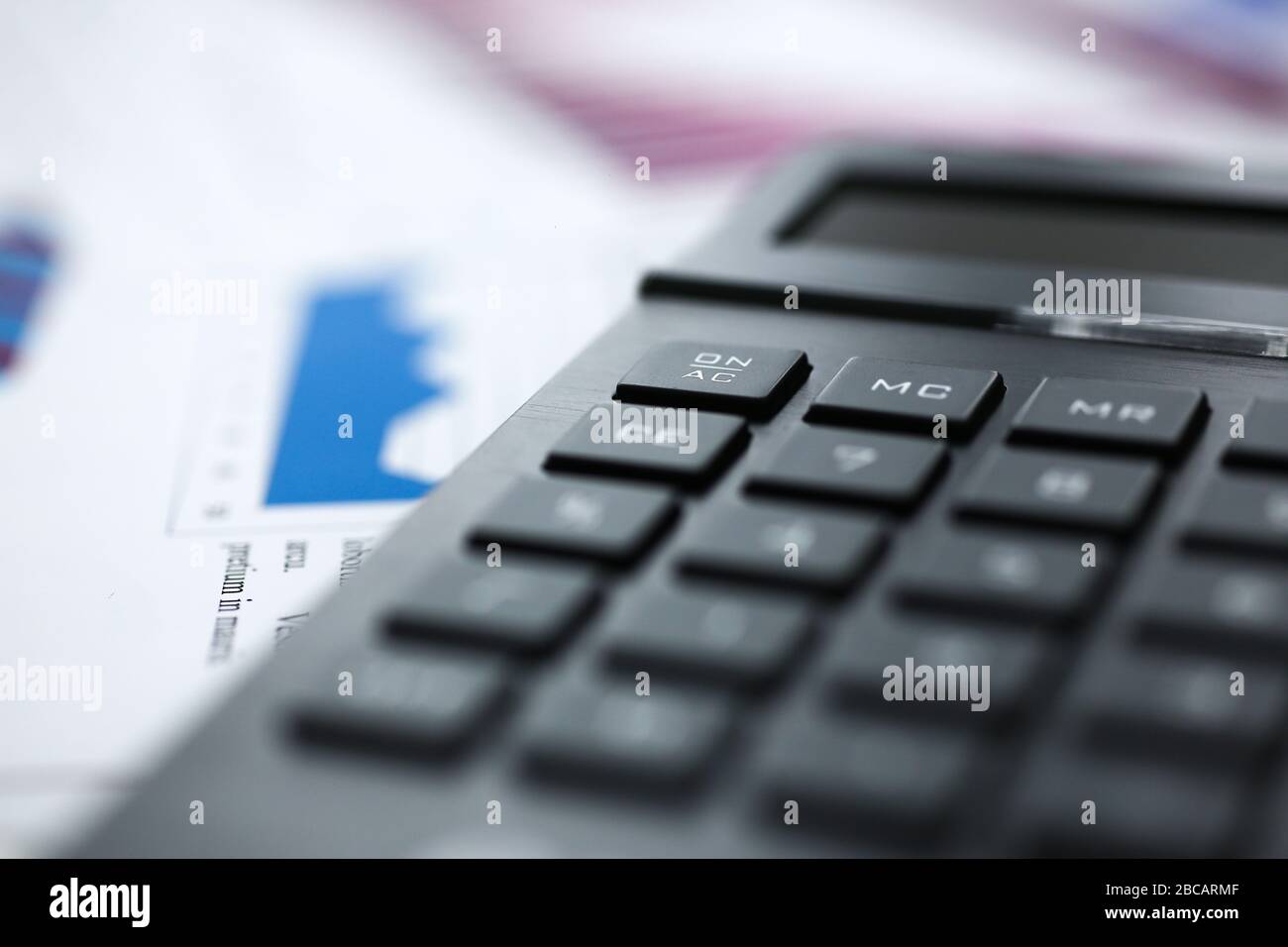Black calculator and financial statistics on infographics Stock Photo ...
