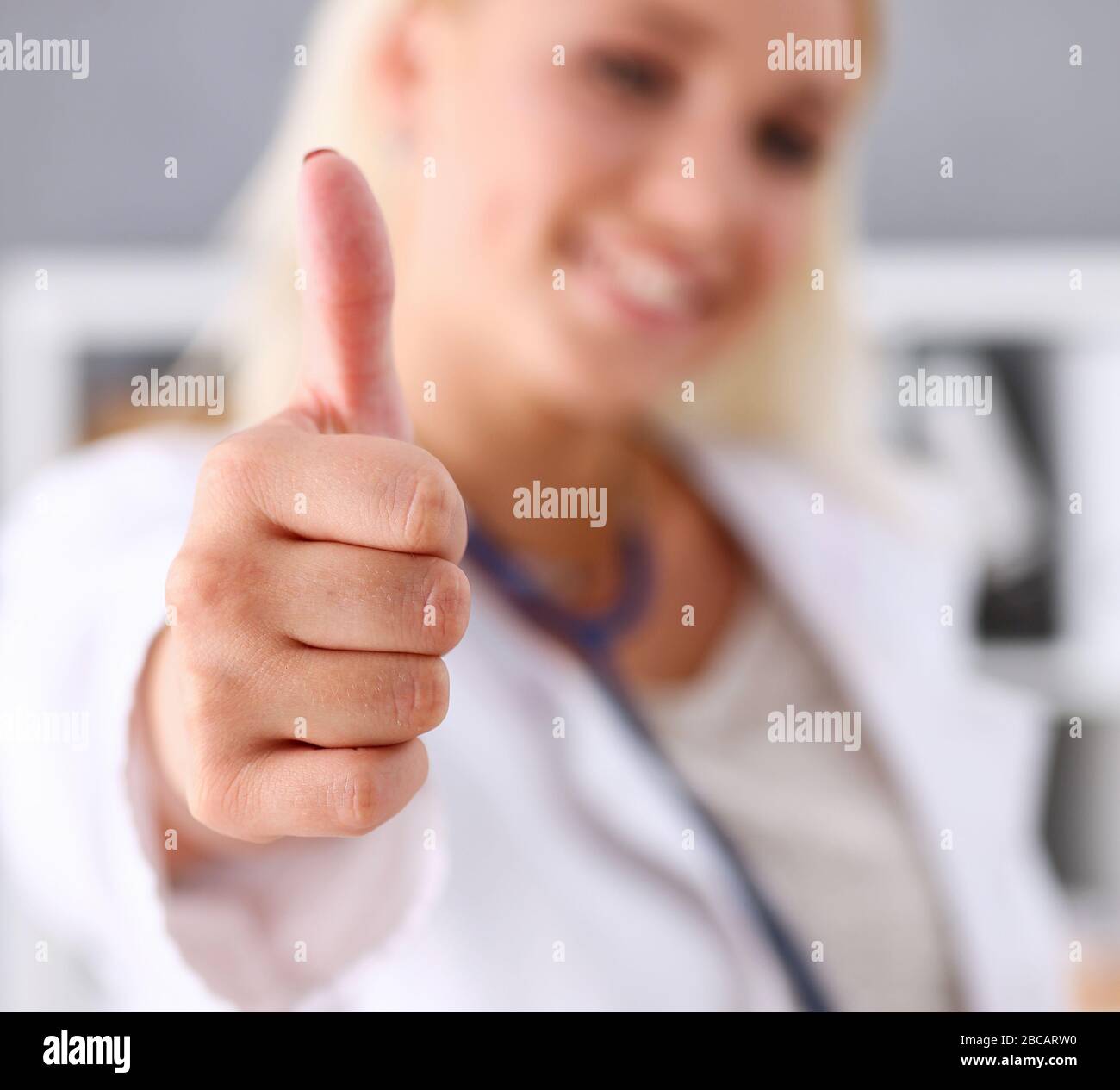 Beautiful smiling female doctor showing OK or confirm sign Stock Photo ...