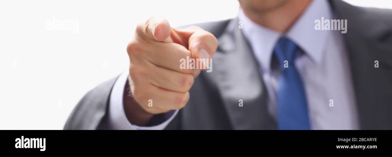 Businessman points a finger at someone who watches a photo Stock Photo ...
