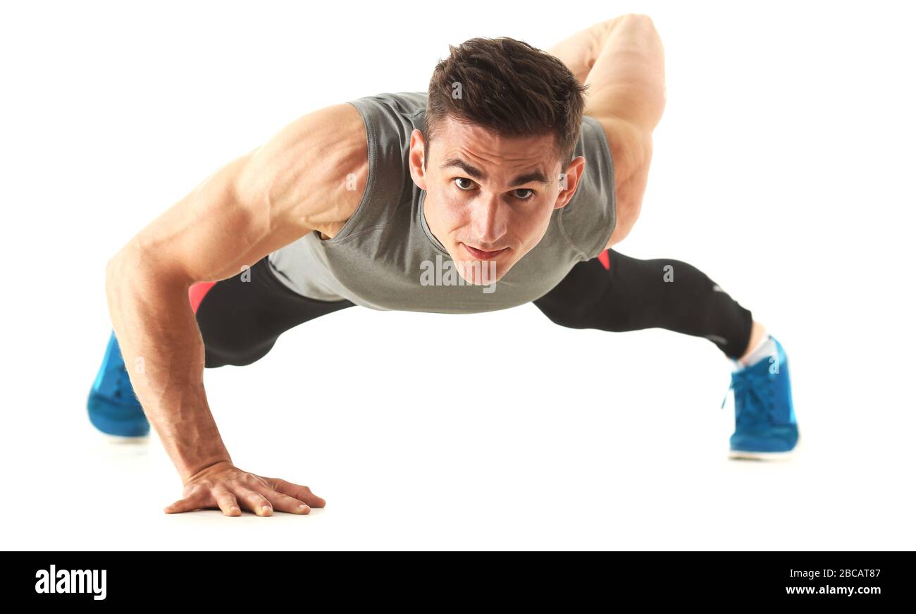 Fitness man wringing from the floor isoladed on white Stock Photo - Alamy