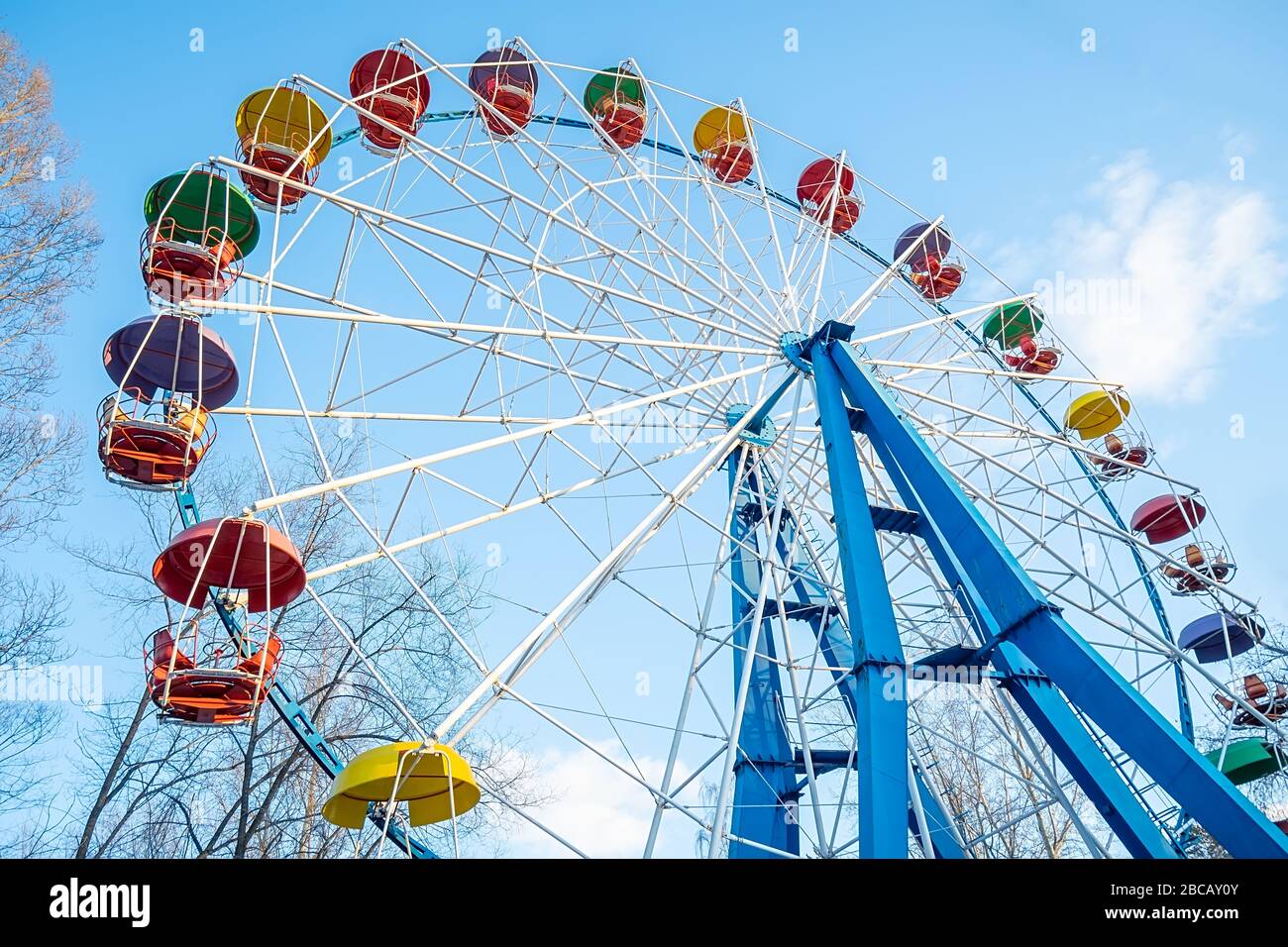 a Ferris wheel from an amusement Park with colorful baskets of seats ...