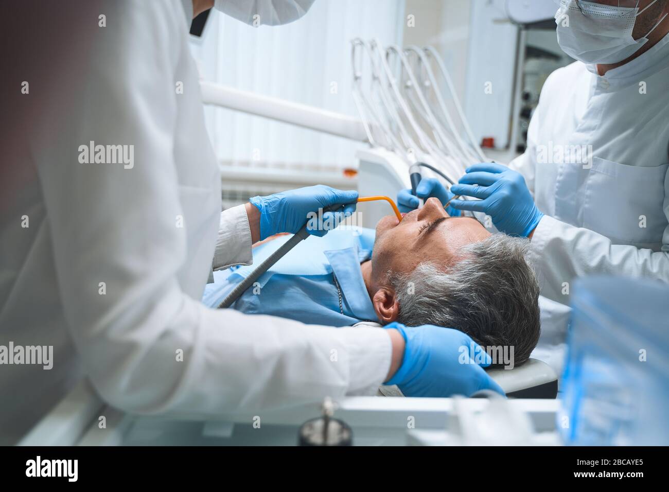 Male having teeth cured in clinic stock photo Stock Photo - Alamy