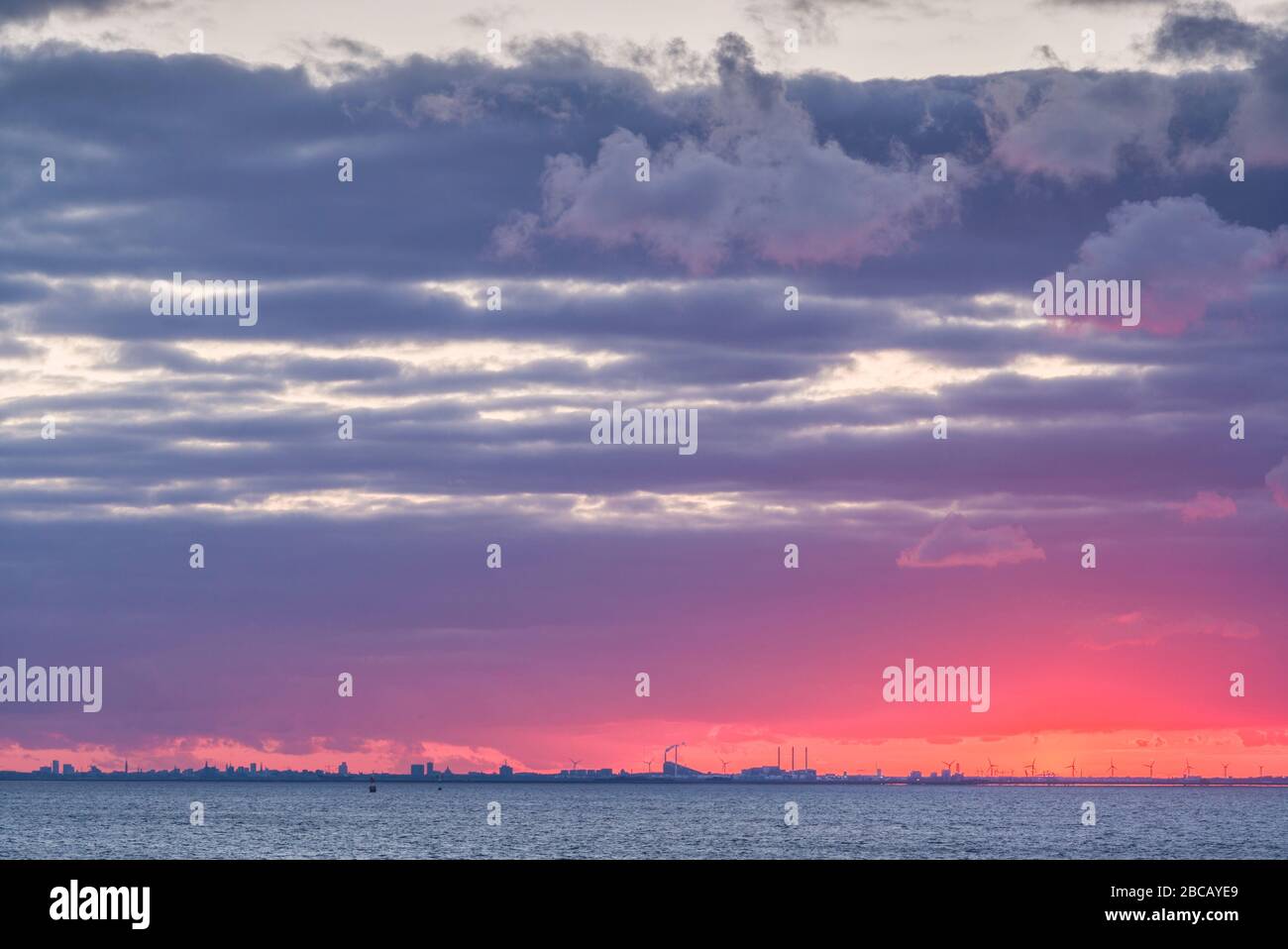 Sweden, Scania, Malmo, Oresund Sound, sunset over Denmark Stock Photo ...