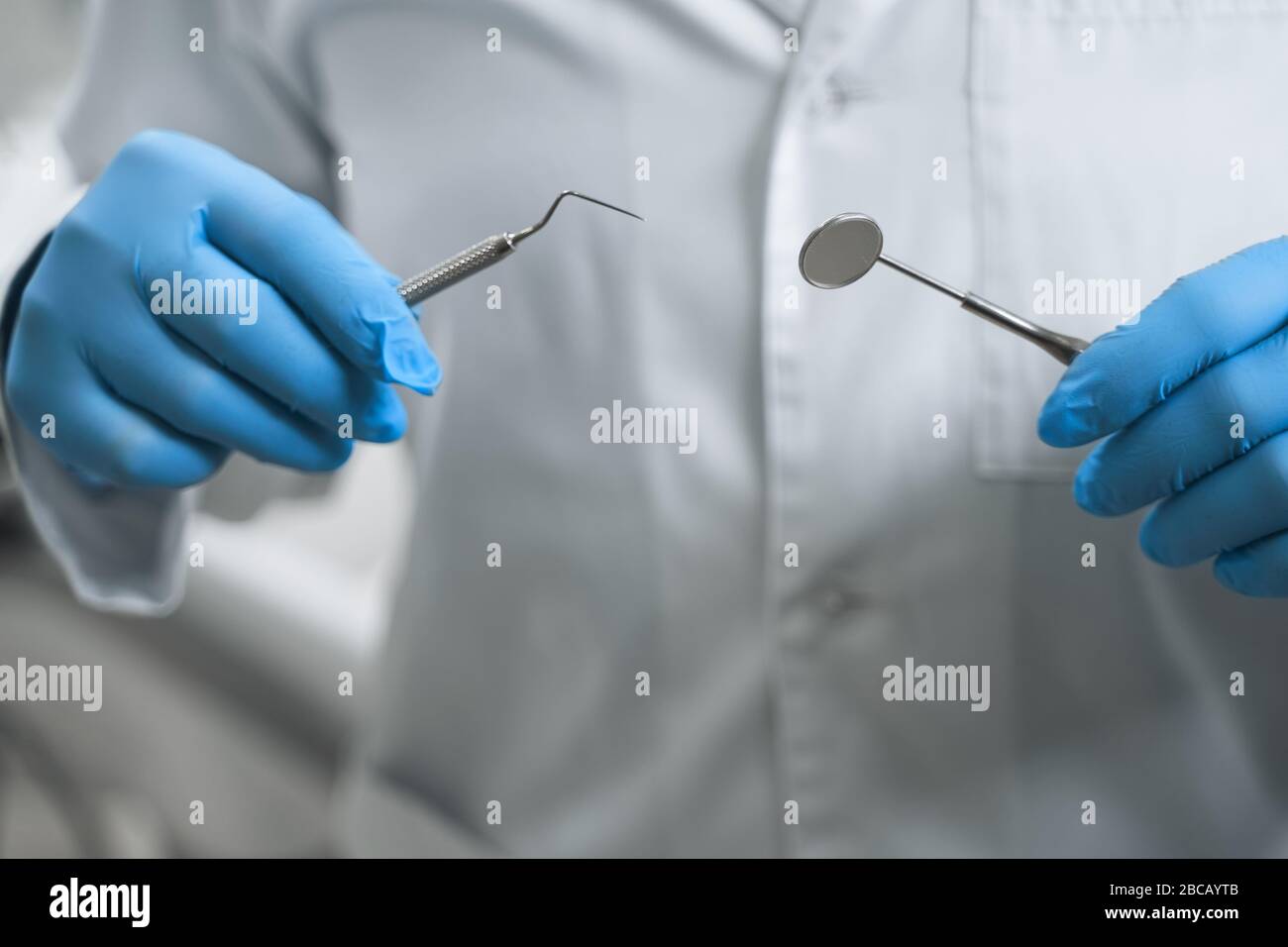Dentist with tools in hands stock photo Stock Photo - Alamy