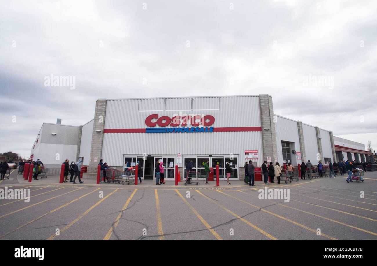 Toronto, Canada. 3rd Apr, 2020. People line up with a social distance ...