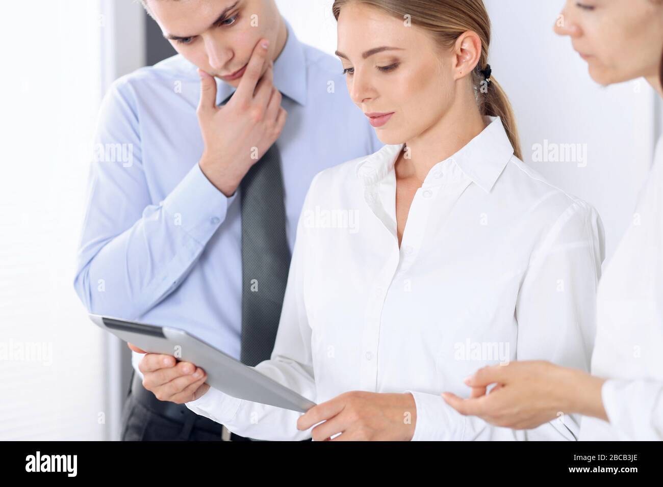 Group of business people using computer in office. Meeting and teamwork ...