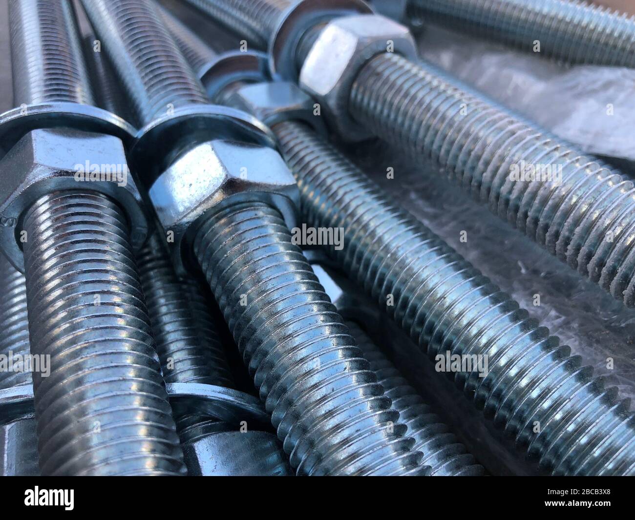 threaded fastening metal studs with nuts and washers Stock Photo - Alamy