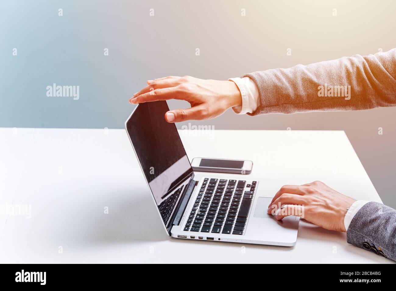 Someone Closing Their Laptop