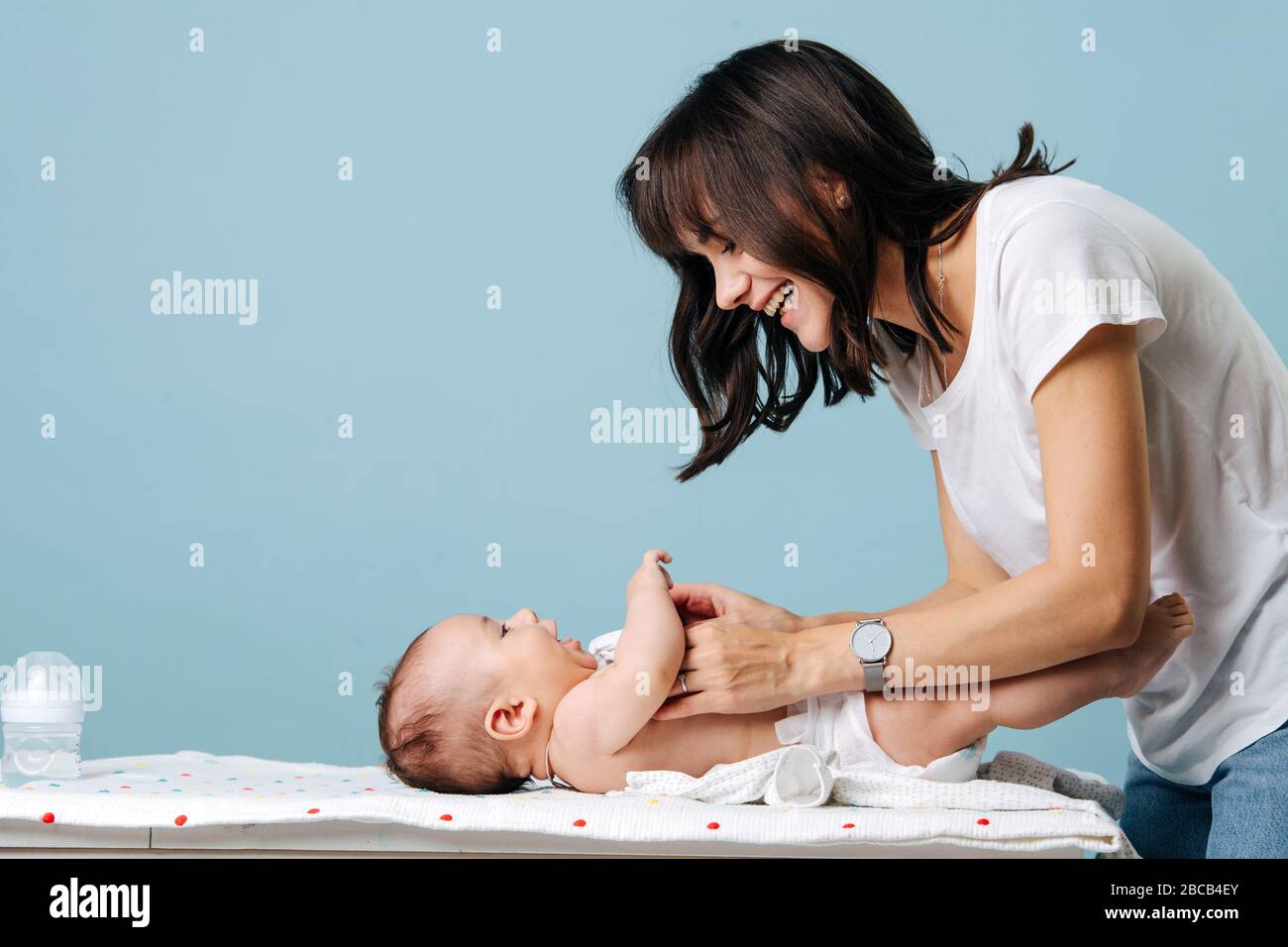 Woman changing babys diaper hi-res stock photography and images - Alamy