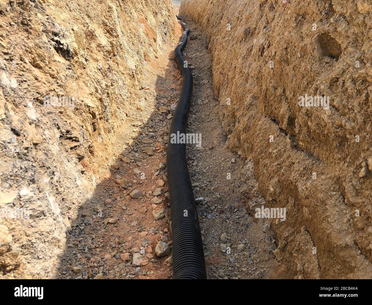 The high voltage electrical cable is laid in a trench Stock Photo - Alamy