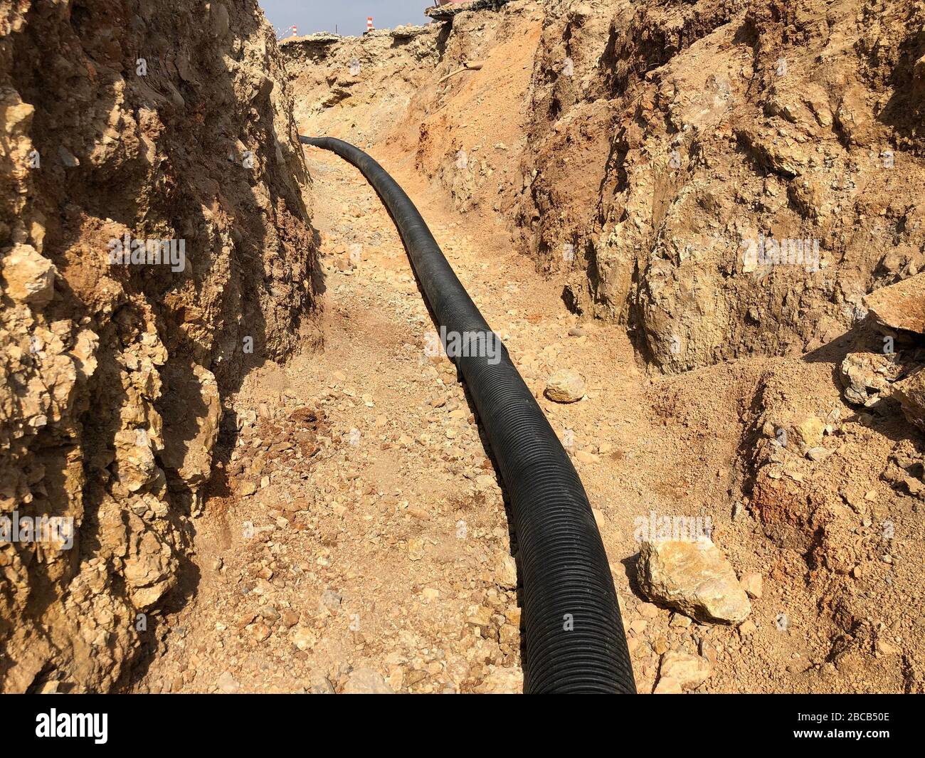The high voltage electrical cable is laid in a trench Stock Photo - Alamy