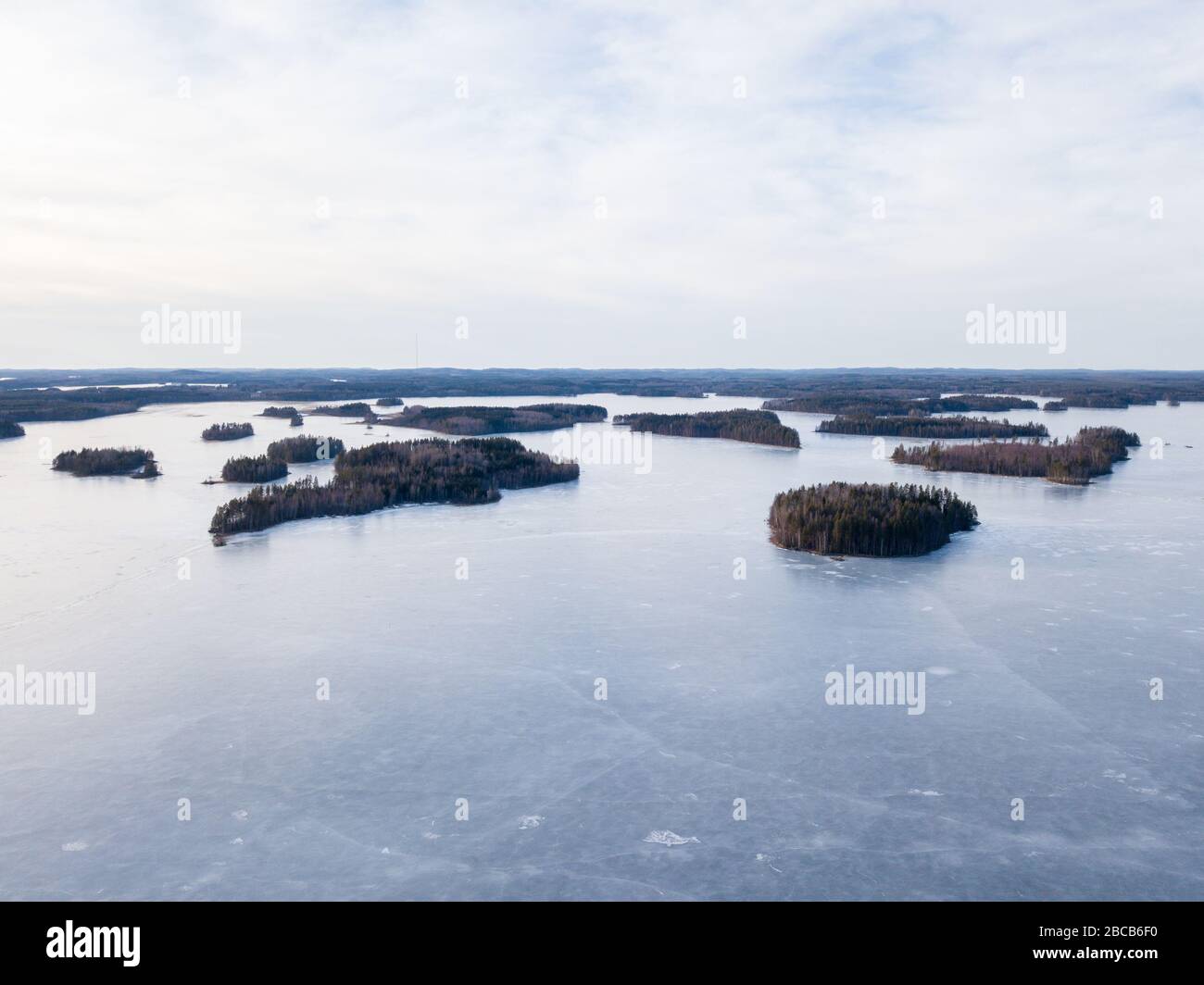 Islands at frozen lake Stock Photo - Alamy