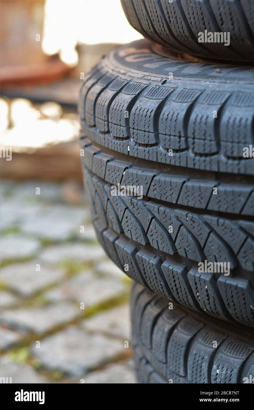 old winter tyres in portrait format Stock Photo - Alamy