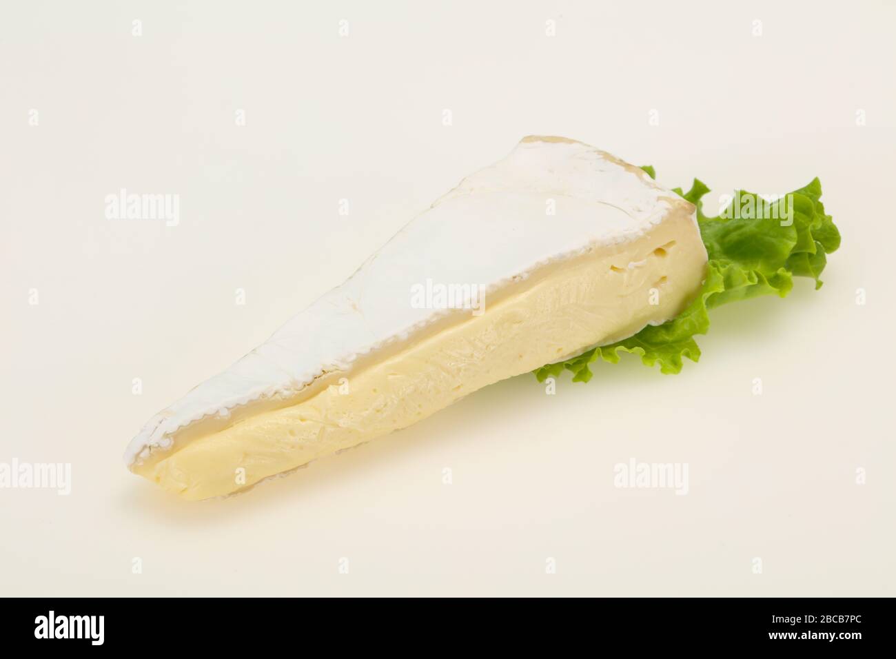 Brie cheese triangle served salad leaves Stock Photo - Alamy