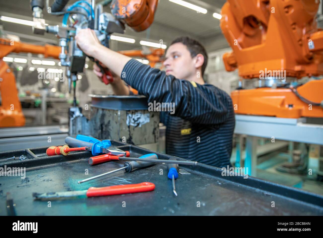Modification of the robot to produce a new product. technically, the ...