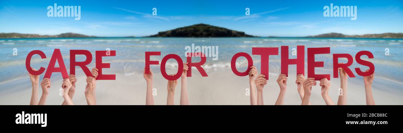 People Hands Holding Word Care For Others, Ocean Background Stock Photo ...