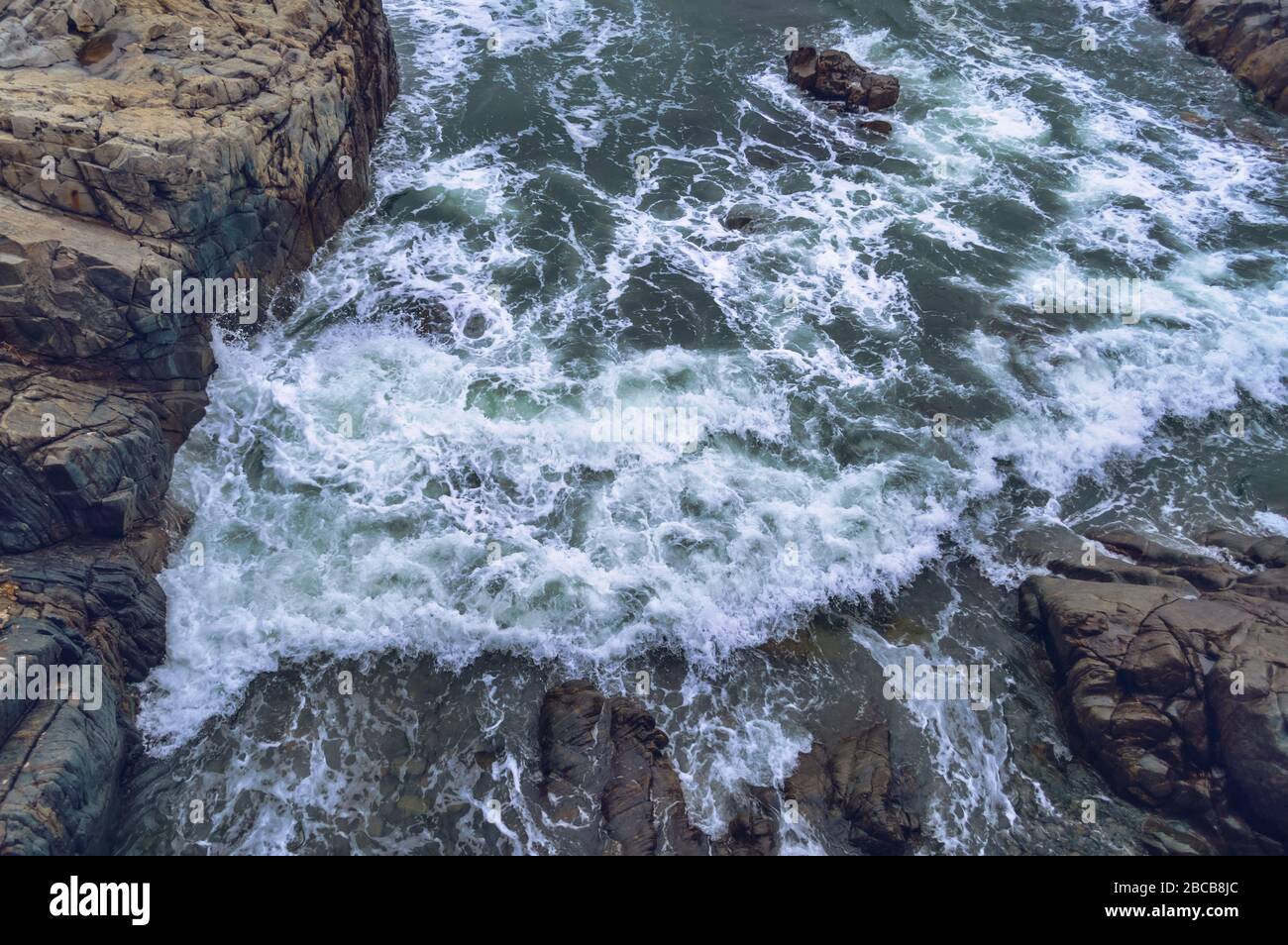 view from above on restless sea waves bumping intorugged stones Stock ...