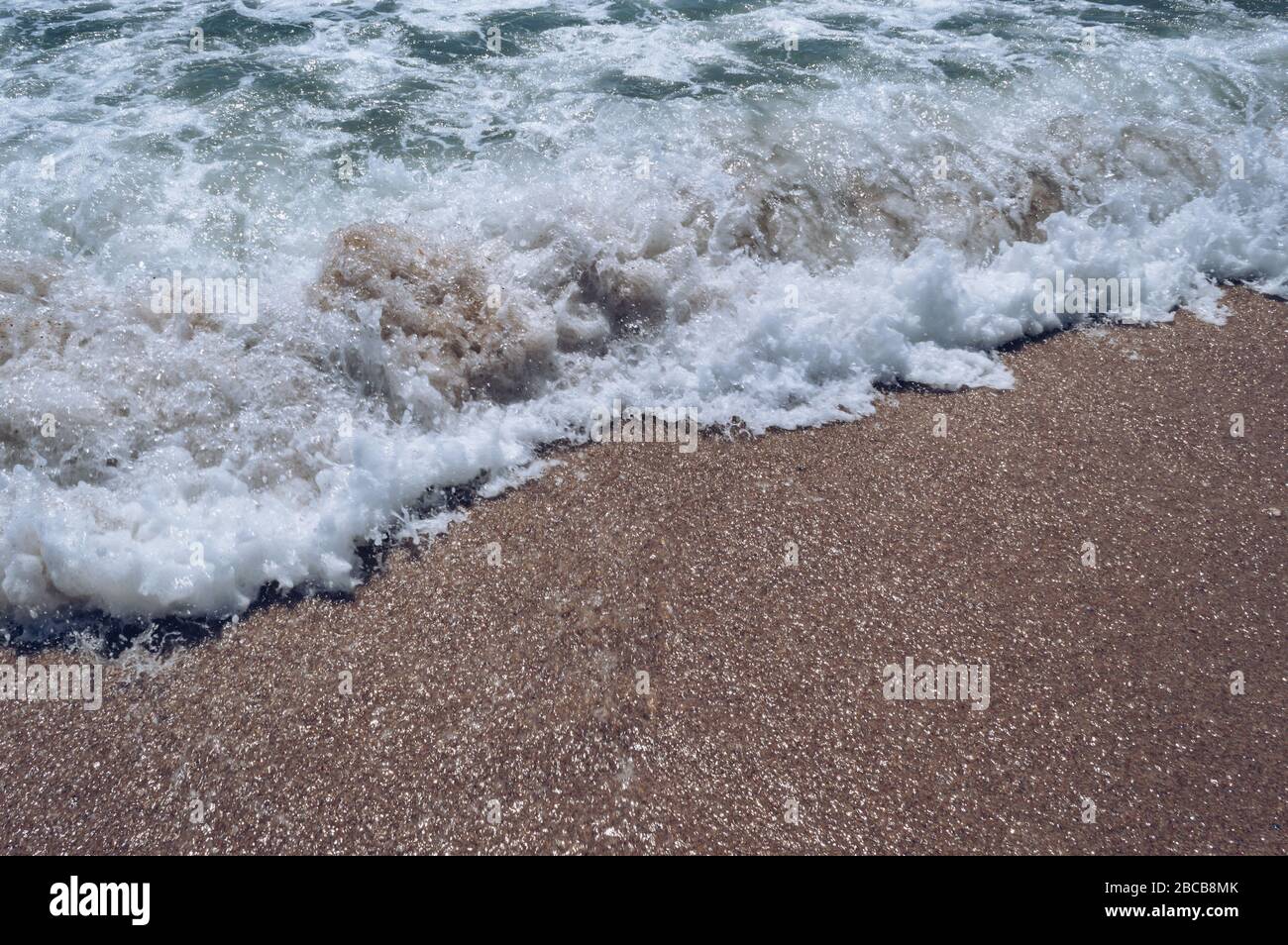 sea foam and sand on hot sunny windy day Stock Photo - Alamy