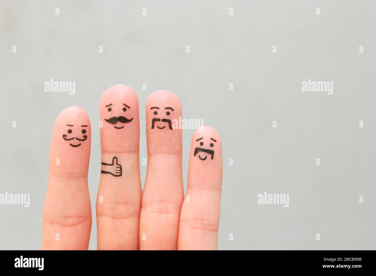 Finger art of happy men with mustache Stock Photo - Alamy