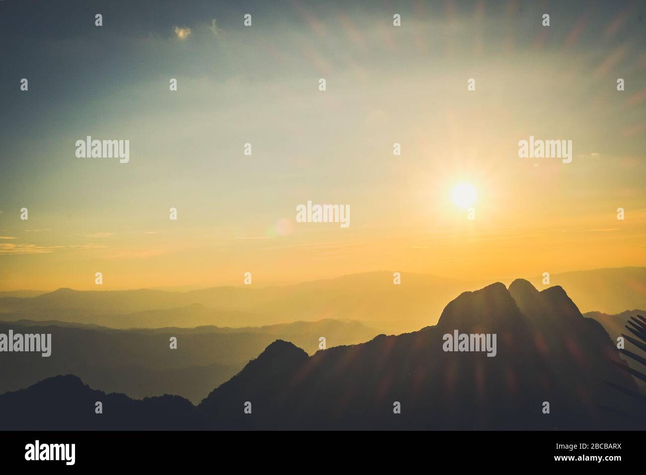 sunrise sky backlit with big mountain Stock Photo - Alamy
