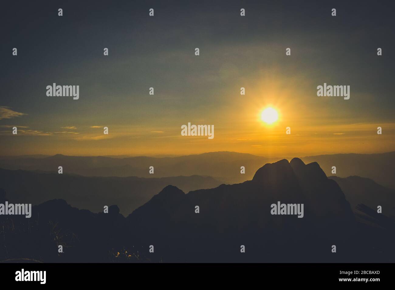 sunrise sky backlit with big mountain Stock Photo - Alamy