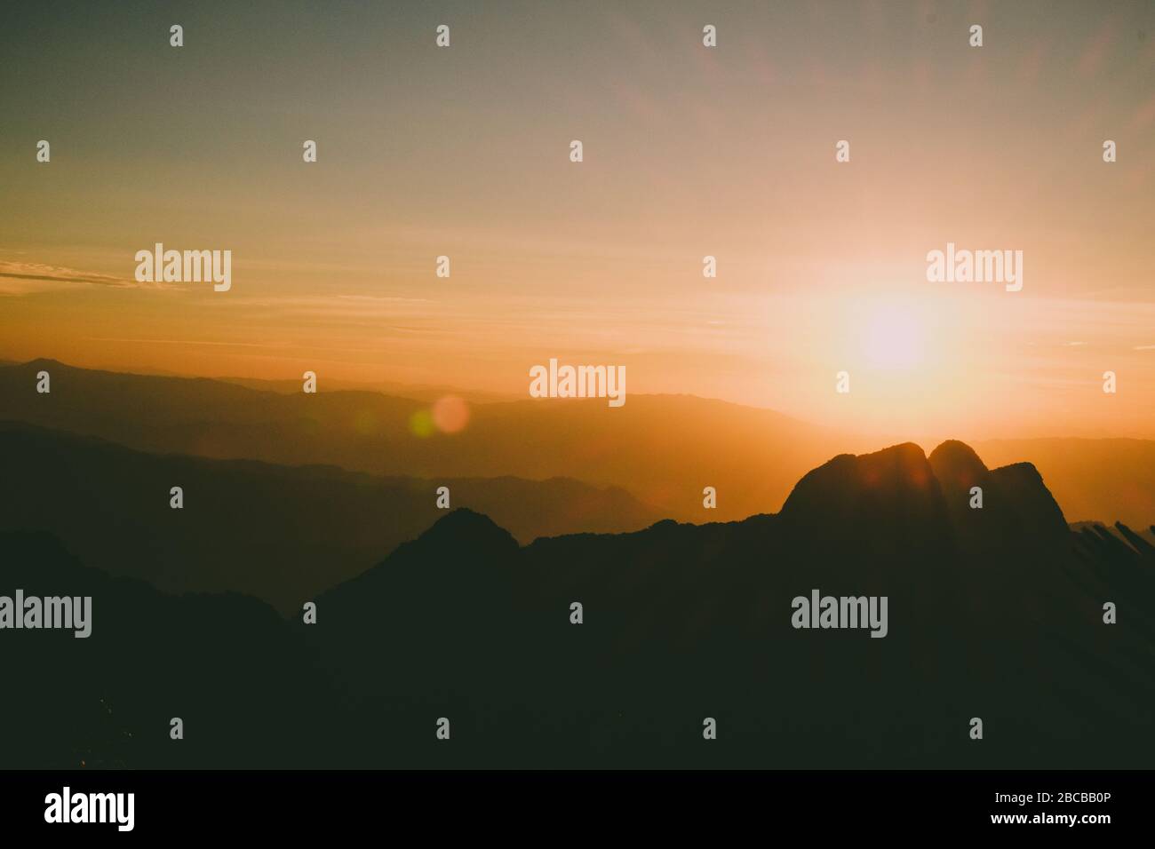 sunrise sky backlit with big mountain Stock Photo - Alamy