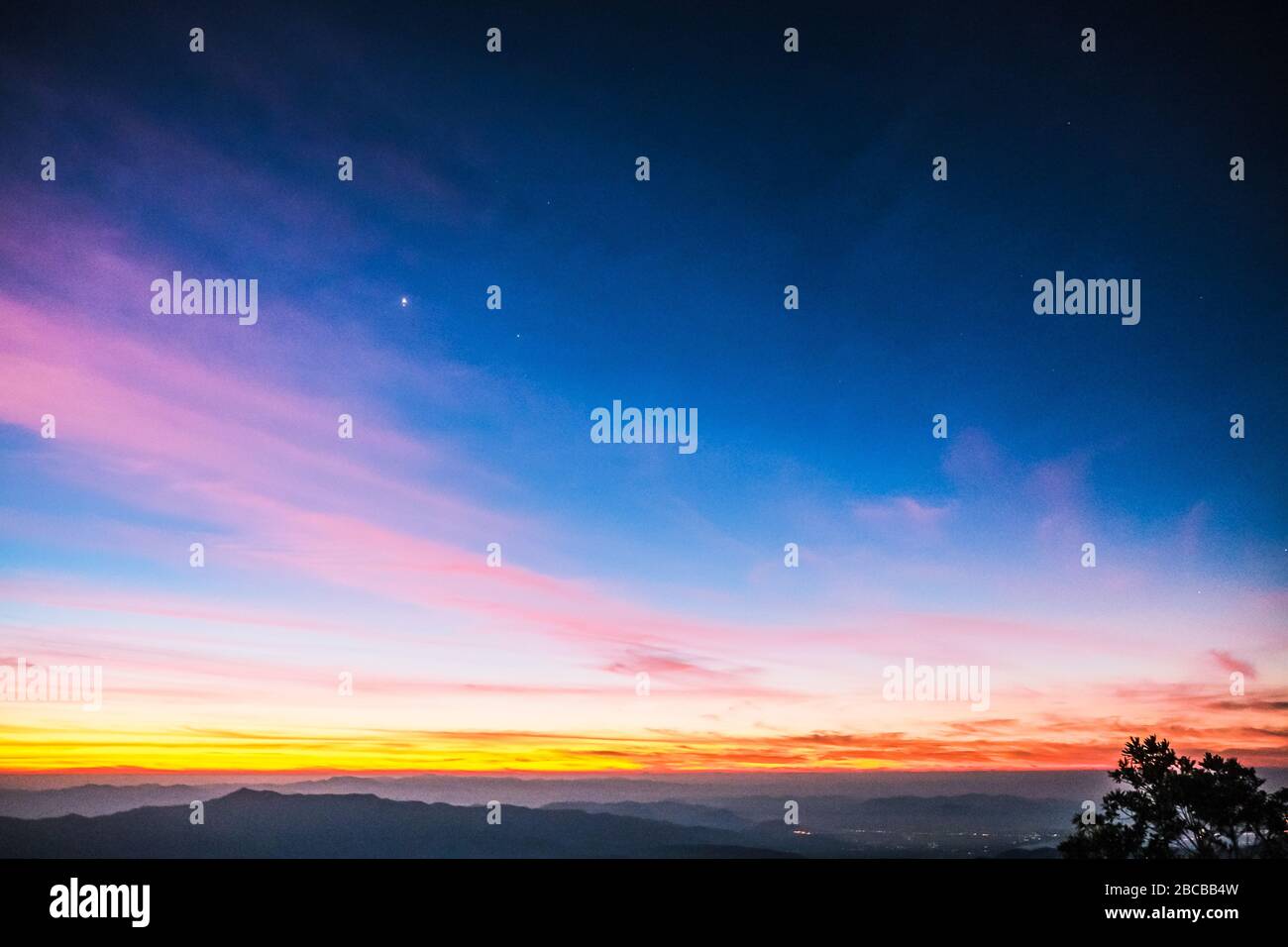 sky shading in the morning from orange to blue Stock Photo - Alamy