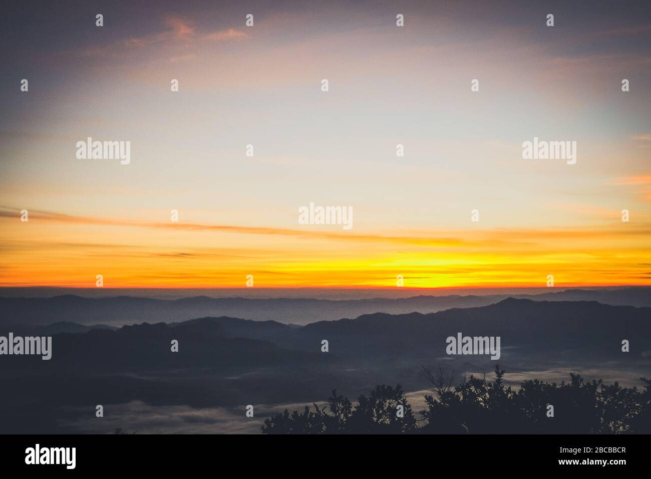 sky shading in the morning from orange to blue Stock Photo - Alamy