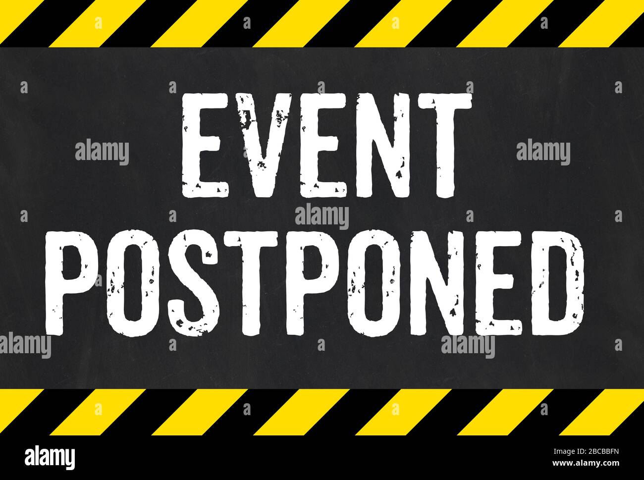 Sign with caution stripes - Event postponed Stock Photo - Alamy