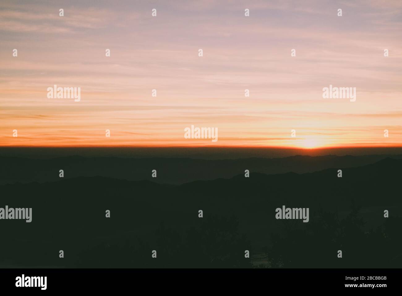 sky shading in the morning from orange to blue Stock Photo - Alamy