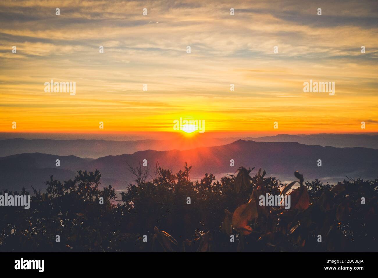 sunrise backlit sky with cloud on the top of mountain Stock Photo - Alamy