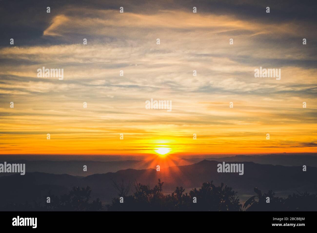 sunrise backlit sky with cloud on the top of mountain Stock Photo - Alamy