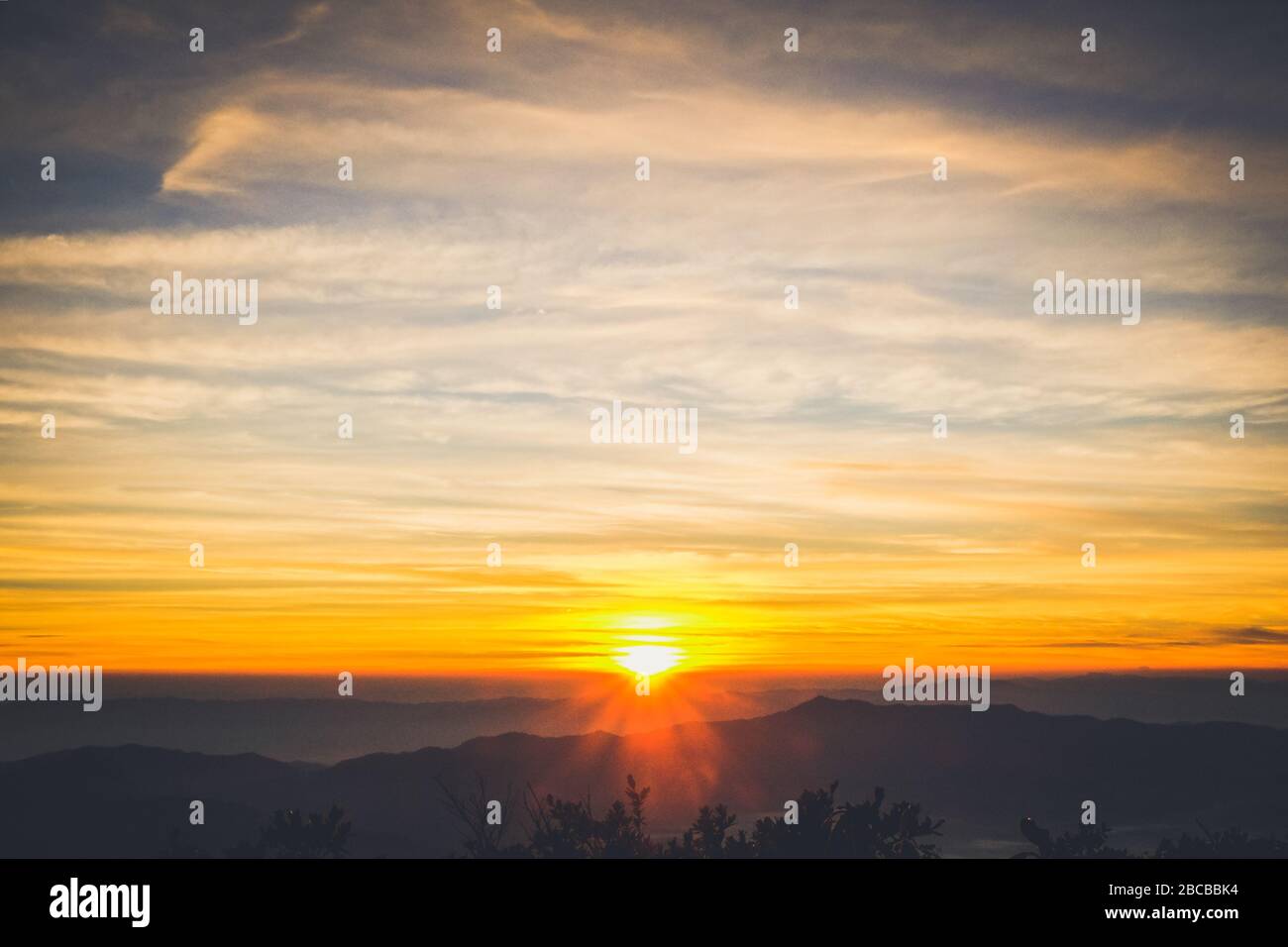 sunrise backlit sky with cloud on the top of mountain Stock Photo - Alamy