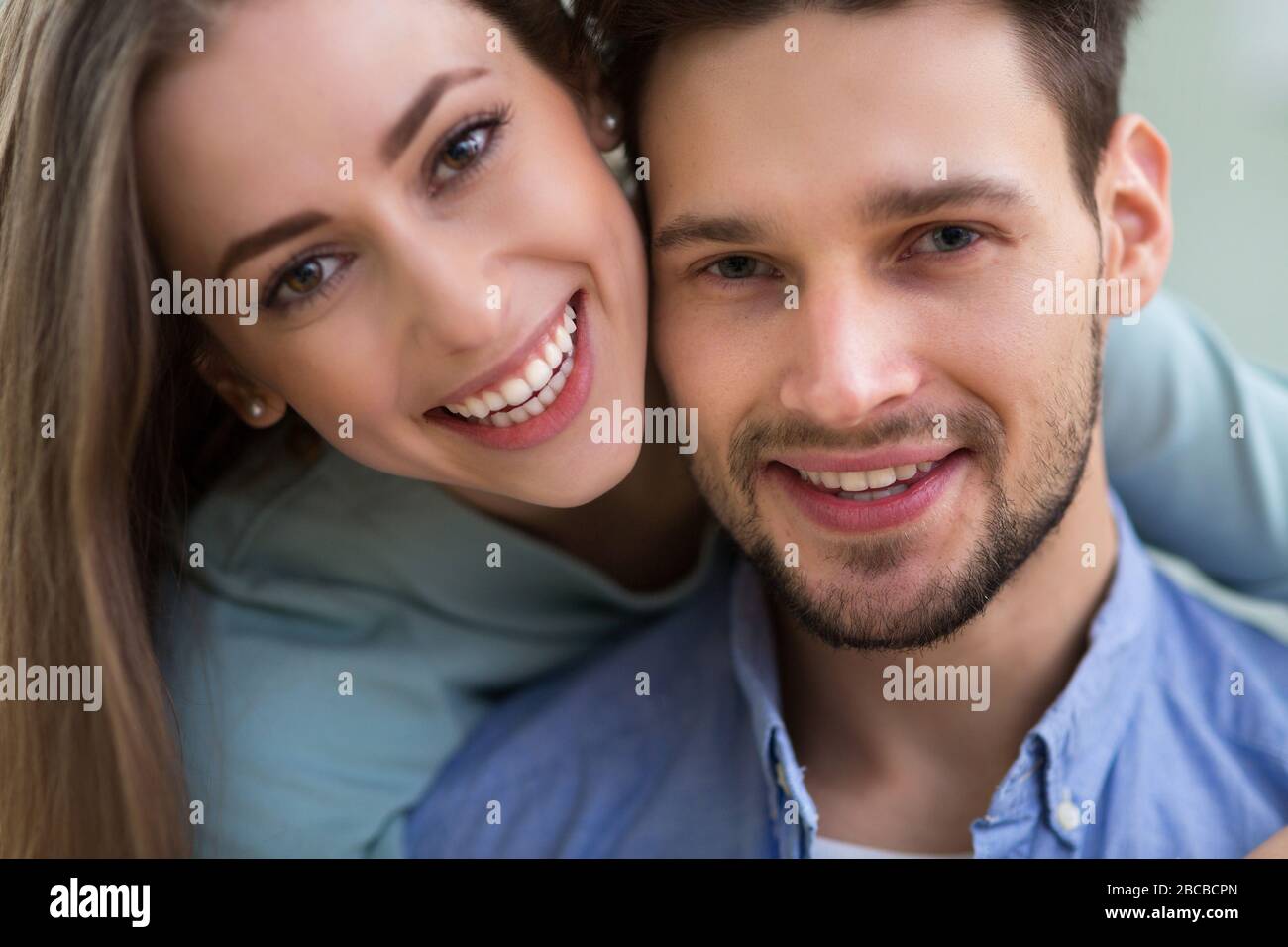 Happy young woman hugging hi-res stock photography and images - Alamy