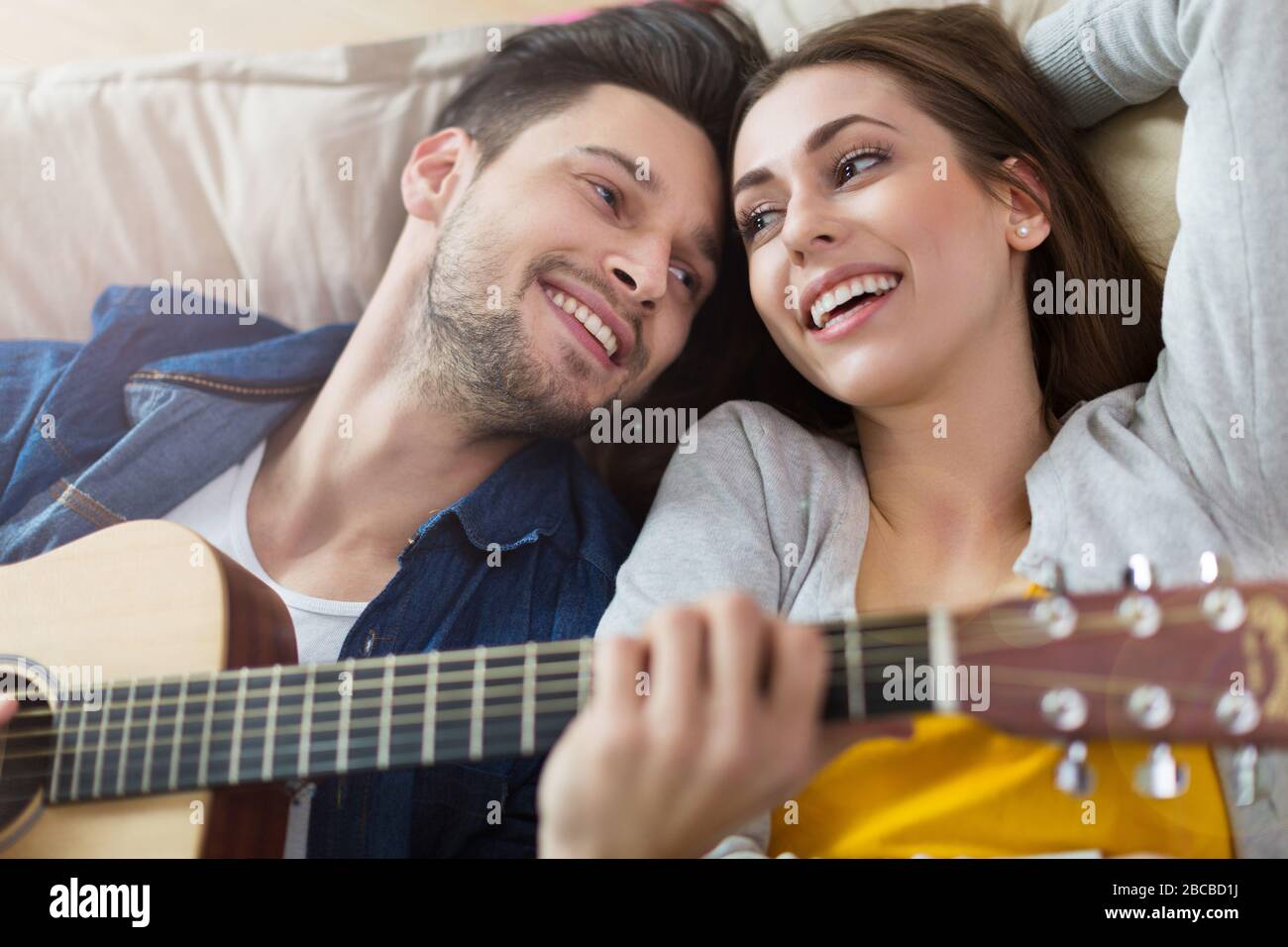 Hugging guitar hi-res stock photography and images - Alamy