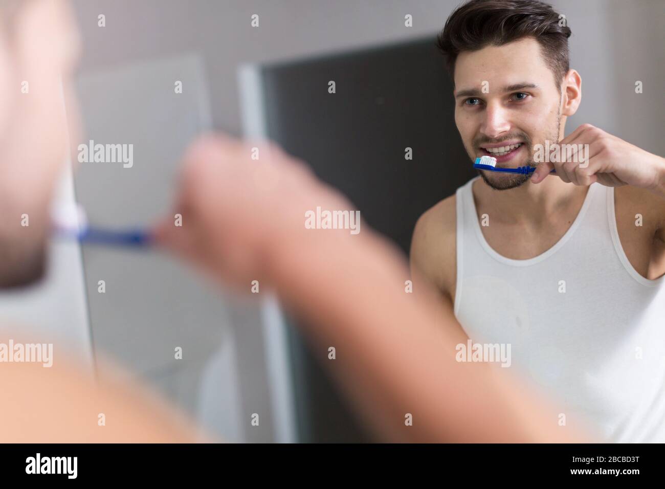 Man brushing teeth Stock Photo - Alamy