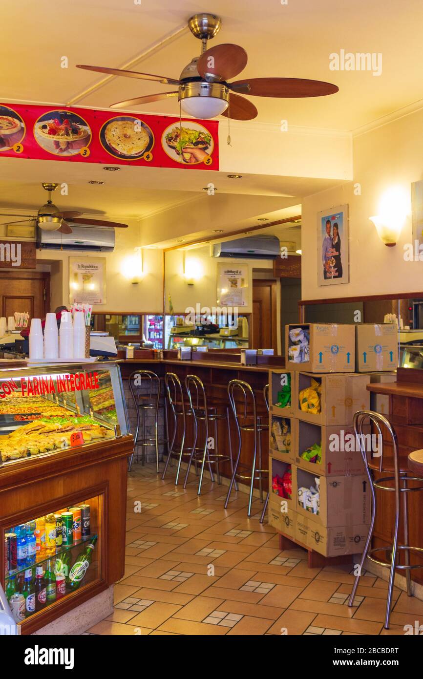 The interior of traditional Italian cafeteria offering typical dishes ...