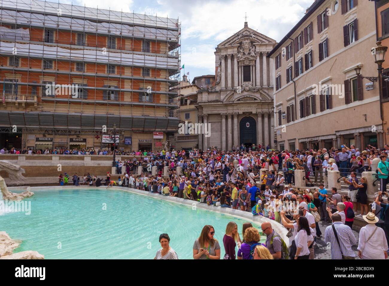 Crowd of tourists admiring Trevi Fountain-the largest Baroque fountain ...