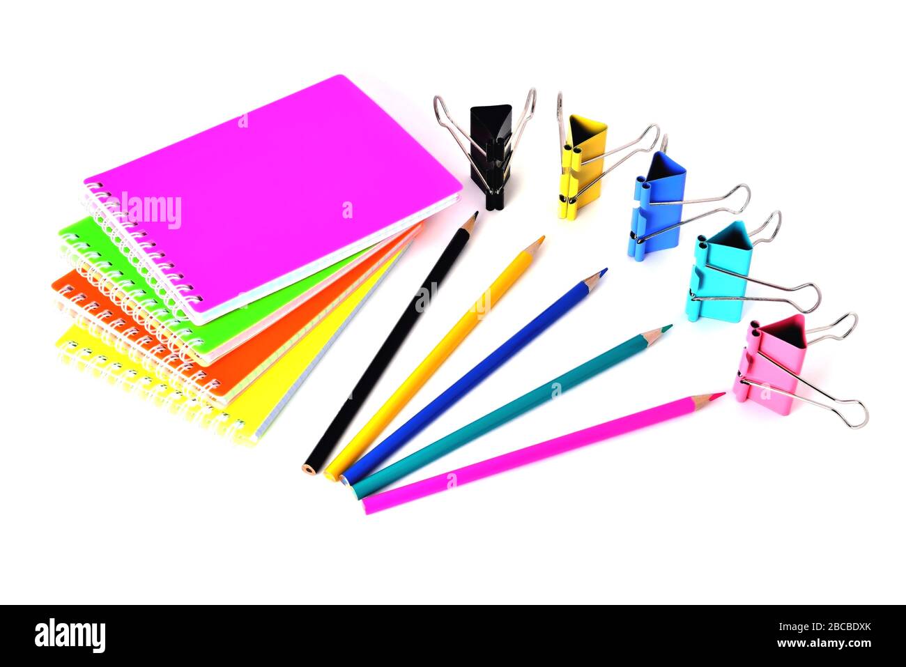 Colorful notepads clip for paper and pencils on a white background in ...