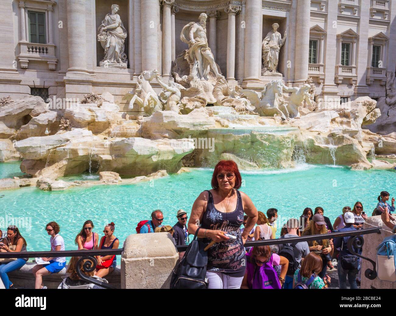 Crowd of tourists admiring Trevi Fountain-the largest Baroque fountain ...