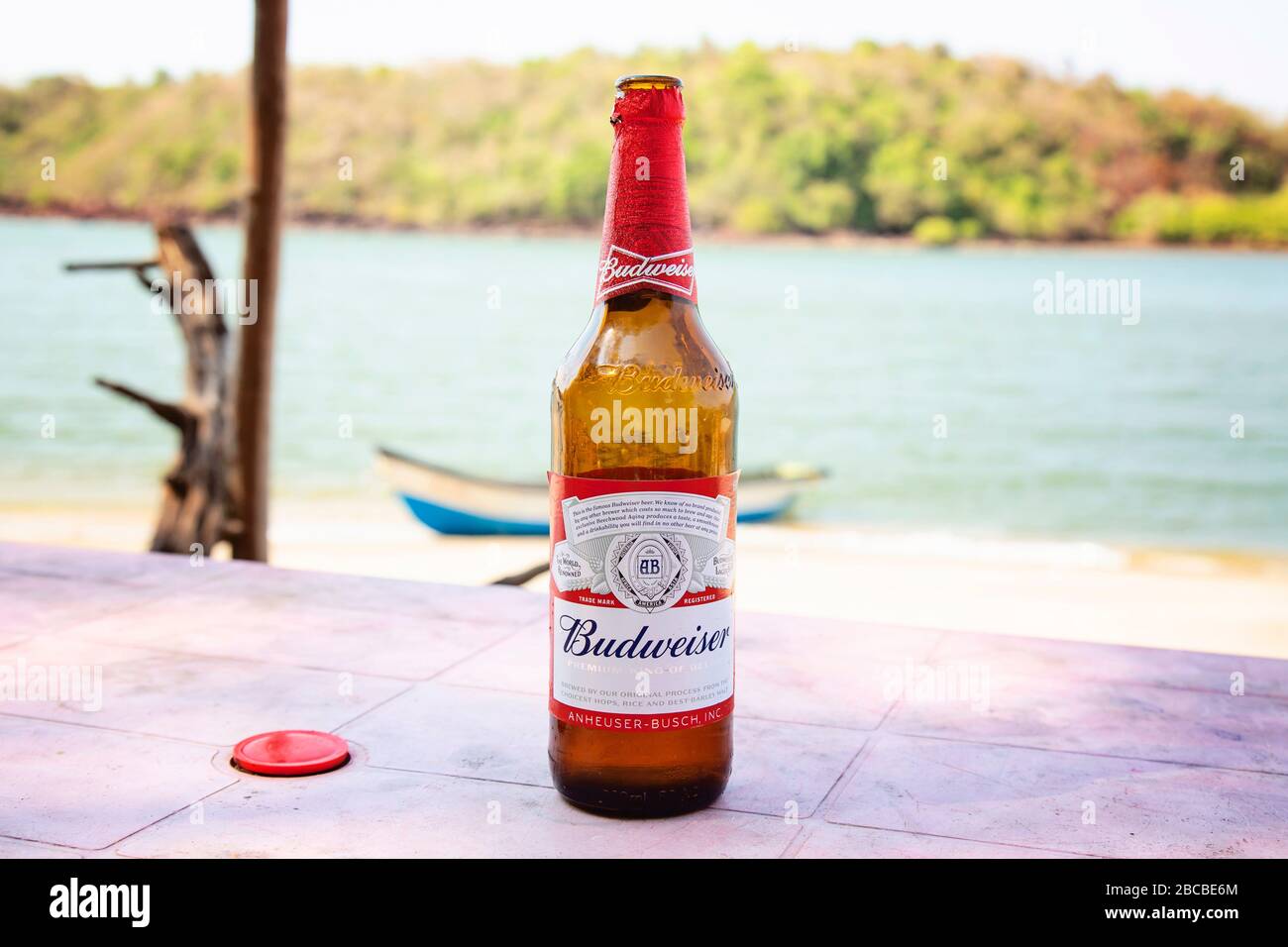 Arambol, Goa, India, 19 March, 2020: Budweiser beer bottle on the beach ...