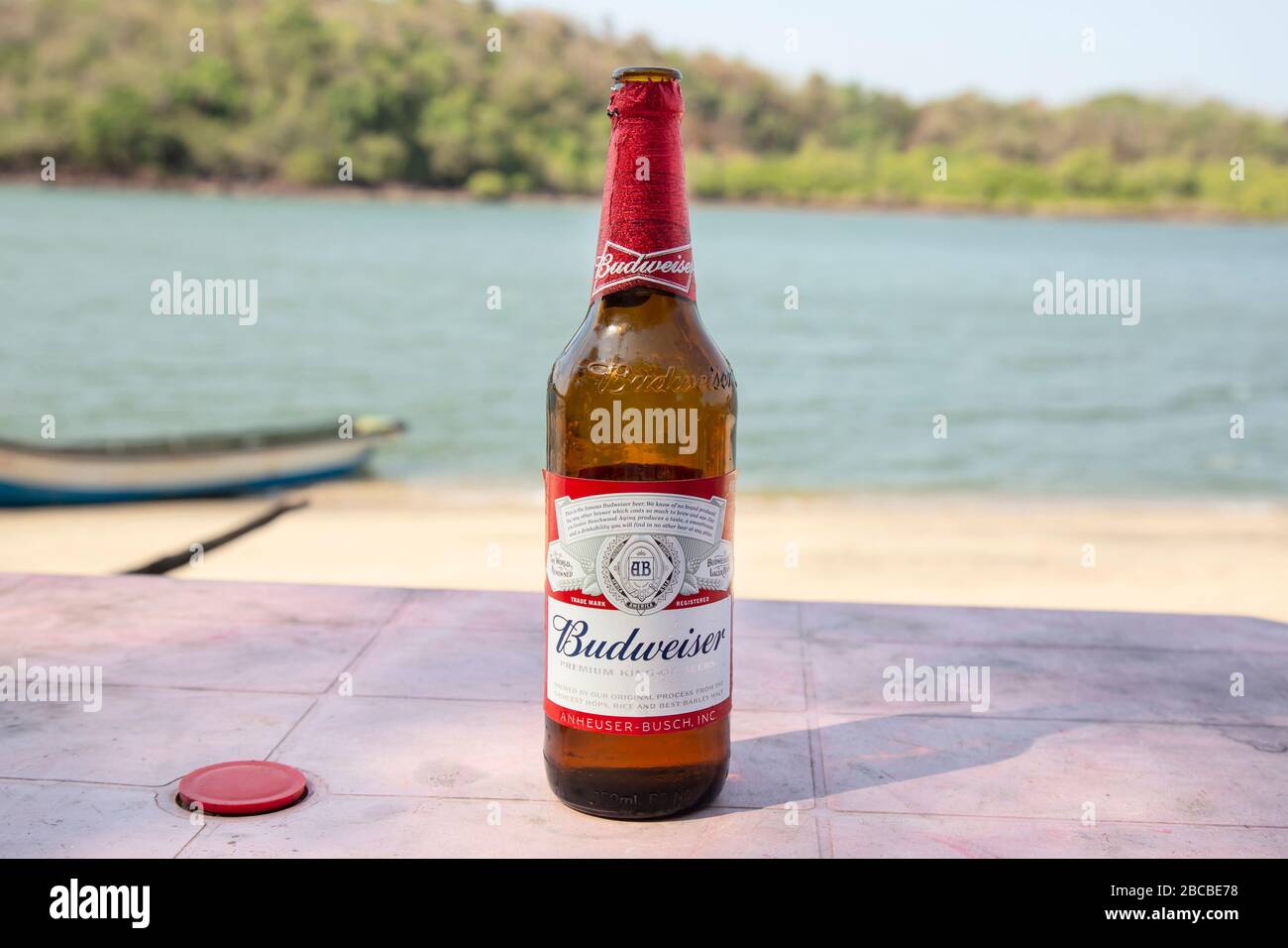 Arambol, Goa, India, 19 March, 2020: Budweiser beer bottle on the beach ...