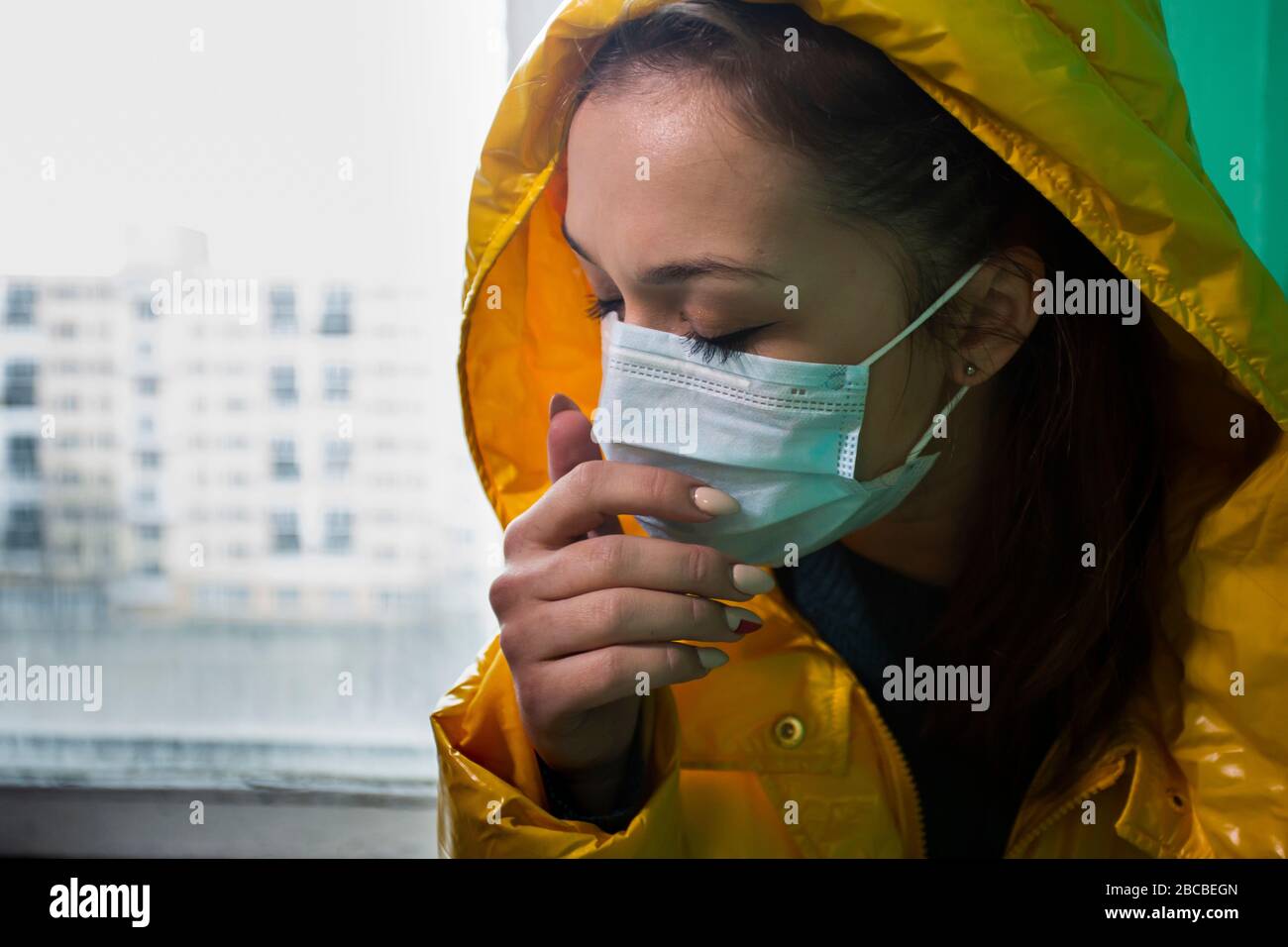 Girl in yellow jacket hood hi-res stock photography and images - Alamy