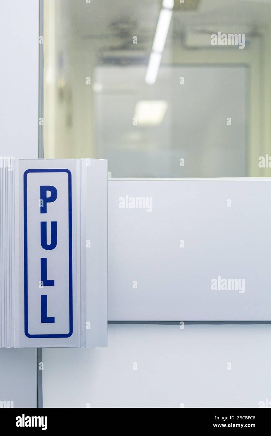 The steel door handle Inside white sterile cleanroom Stock Photo - Alamy