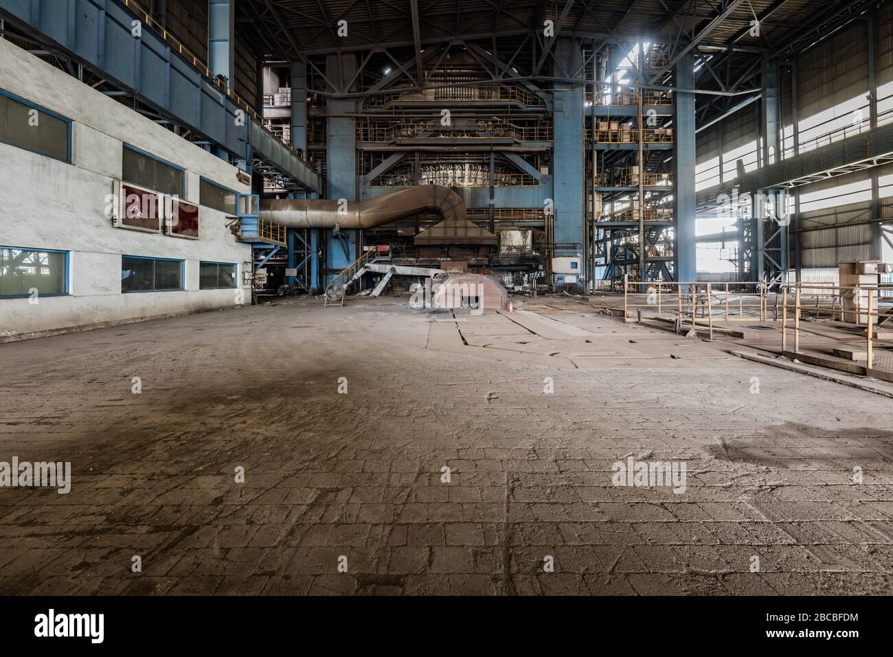 Interior of an old abandoned industrial steel factory Stock Photo - Alamy