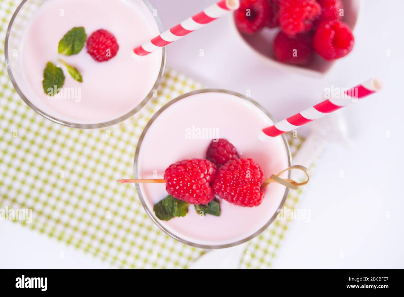 Two portions natural homemade yogurt in a glass jar with fresh ...