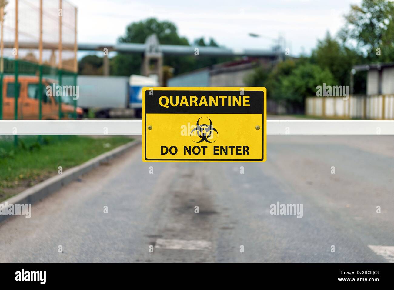 automatic barrier with a Coronavirus Warning sign, Covid-19 containment ...