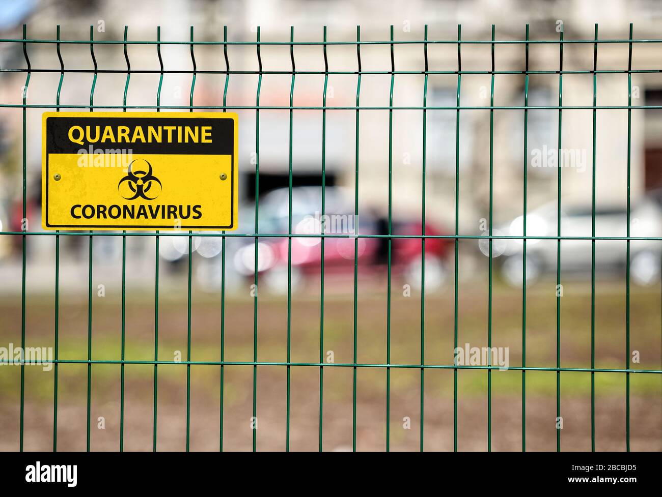 Coronavirus Quarantine sign on green decorative metal wire fence, the ...
