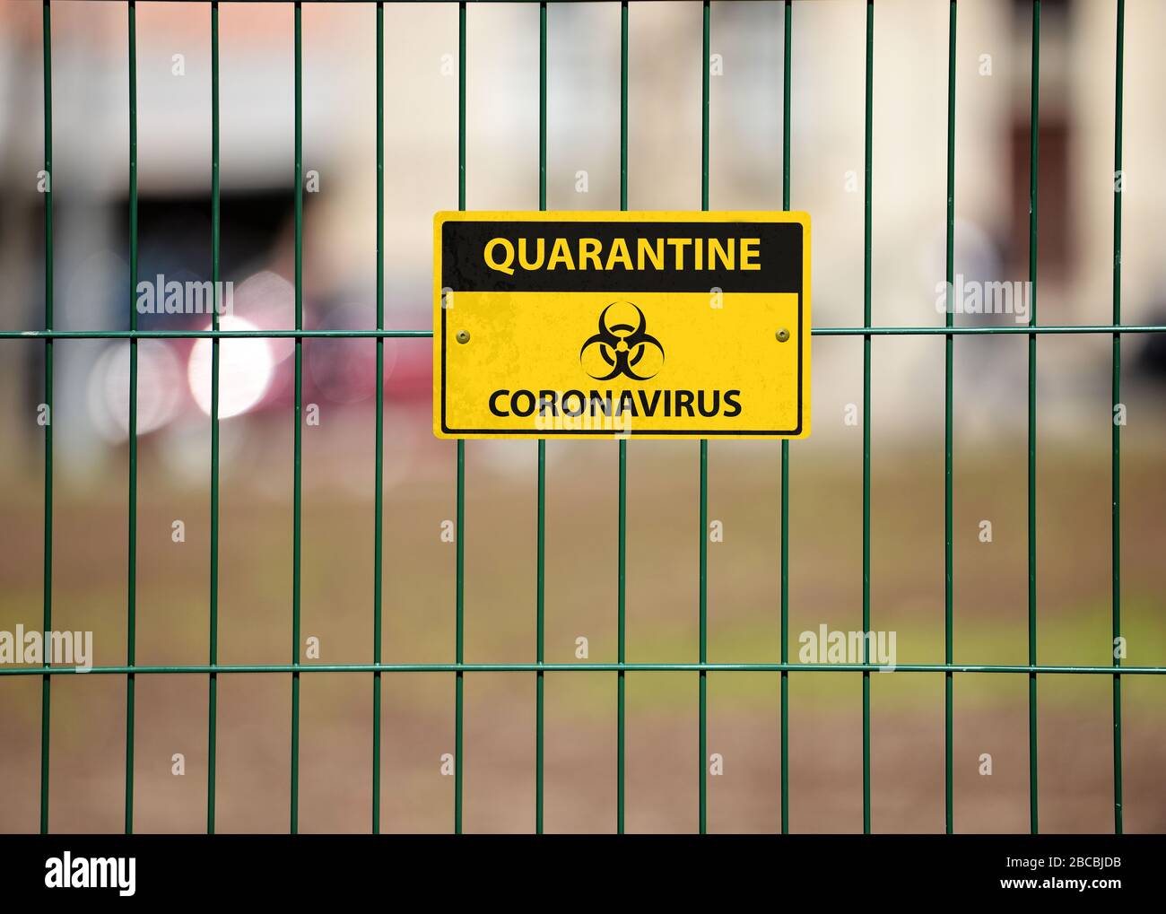 Coronavirus Quarantine sign on green decorative metal wire fence, the ...